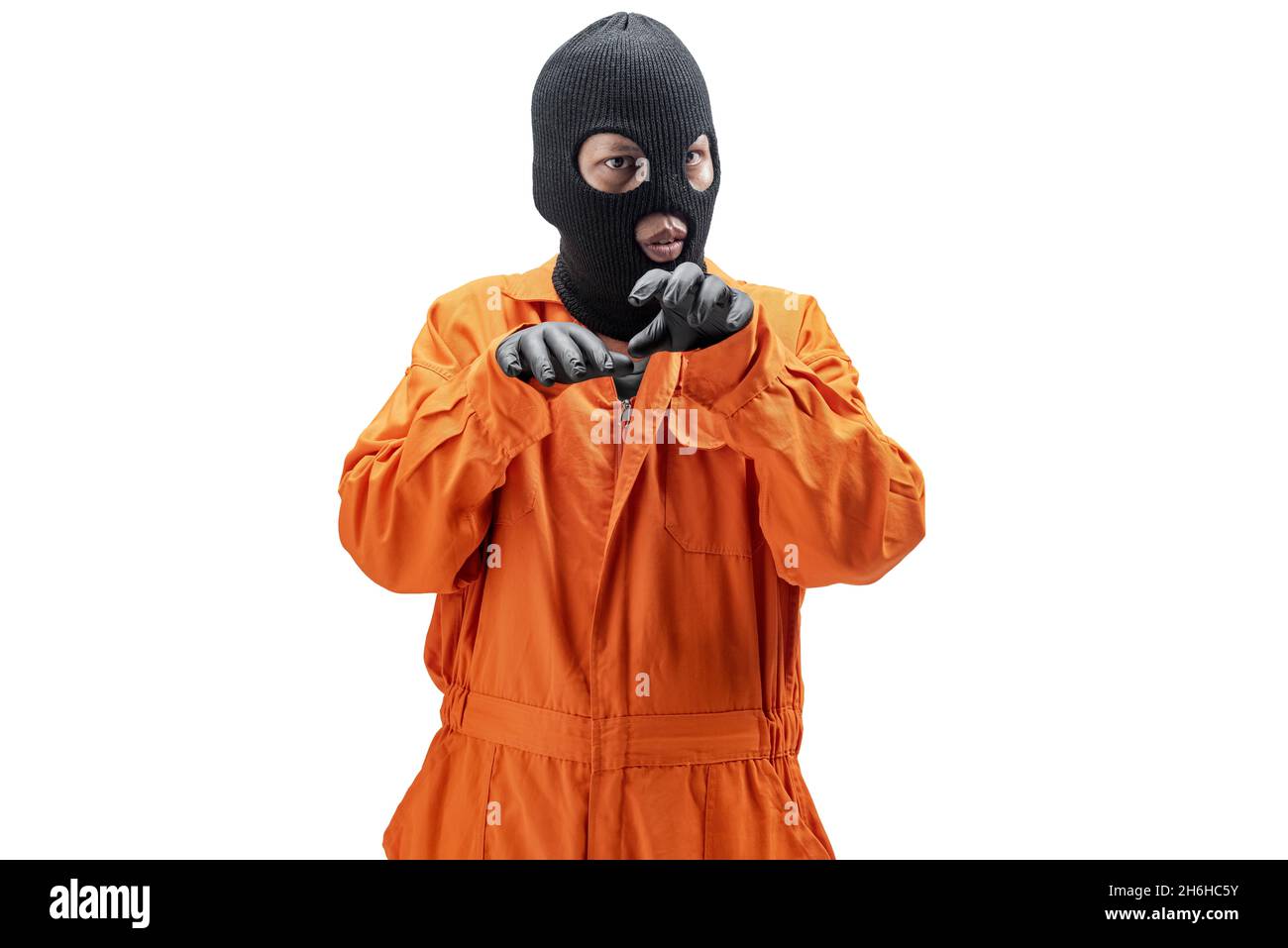 Criminal man a hidden mask with prisoner uniform isolated over white ...