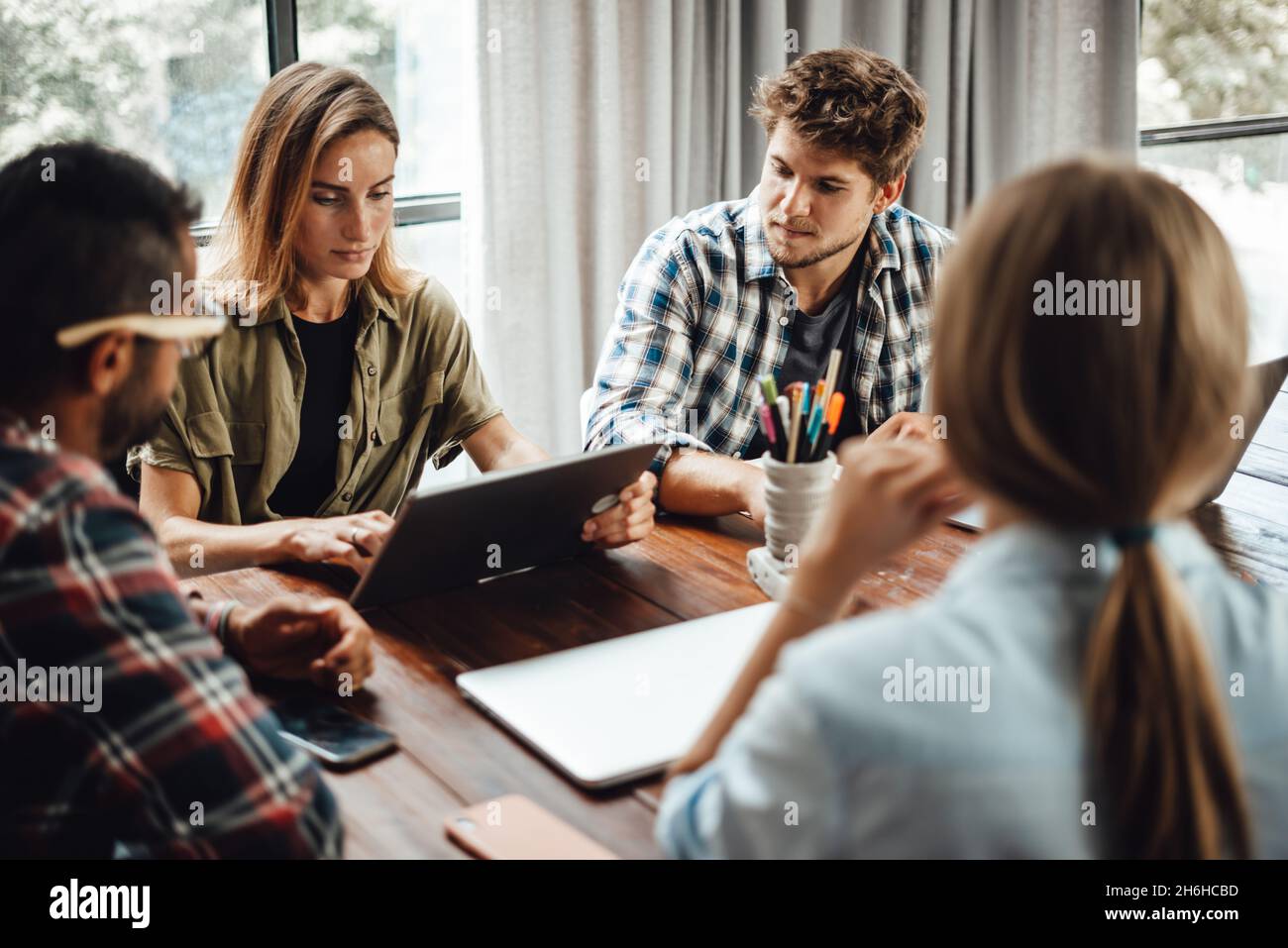 Group of young people working or studying together. Hipster team in ...