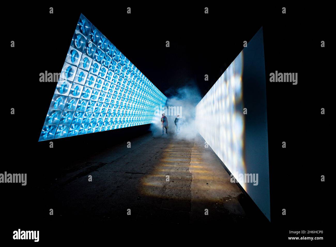 Artists Liam Birtles, left and Anthony Rowe, right, walk through their ...