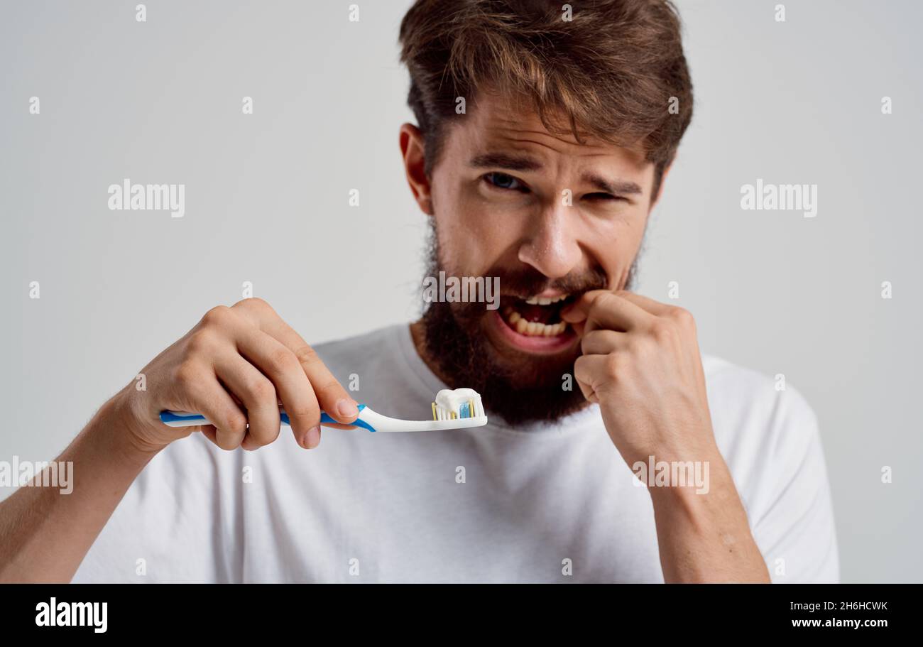 man toothbrush in hand hygiene clean teeth isolated background Stock ...