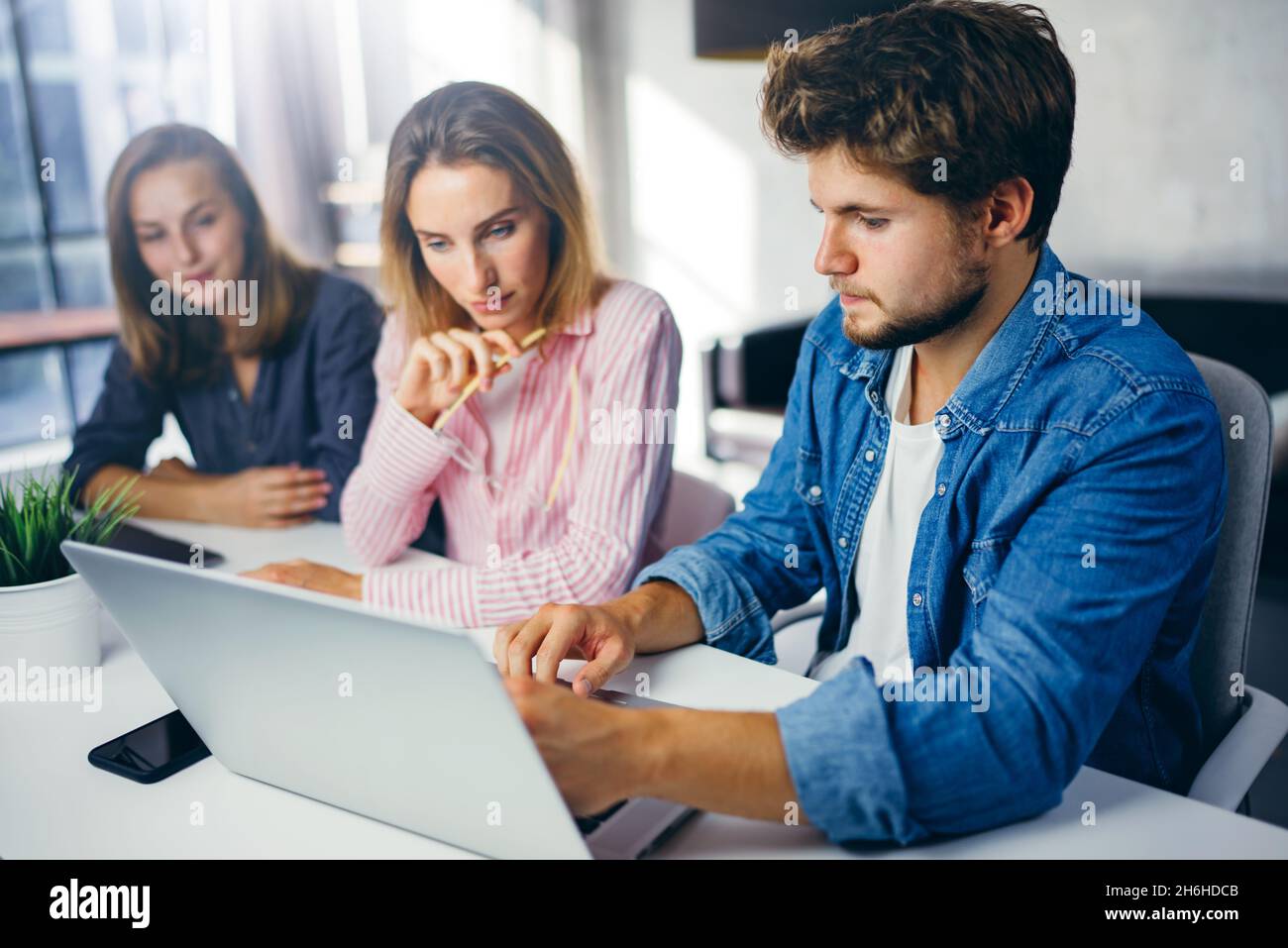 Group of young people working together. Creative business people in ...