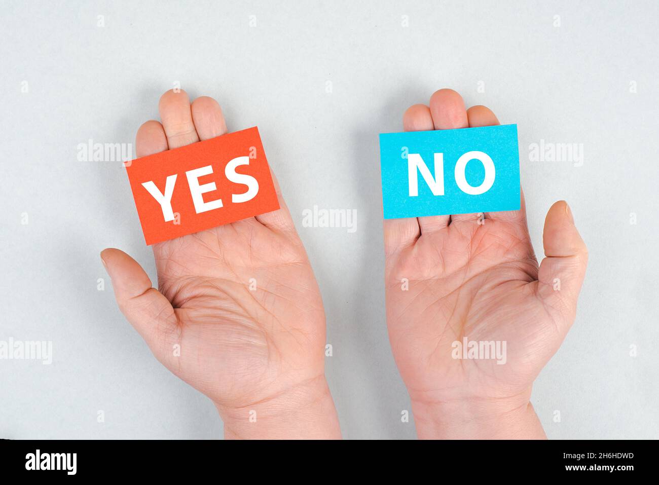 Paper in red and blue, with the words yes and no, communication symbol ...