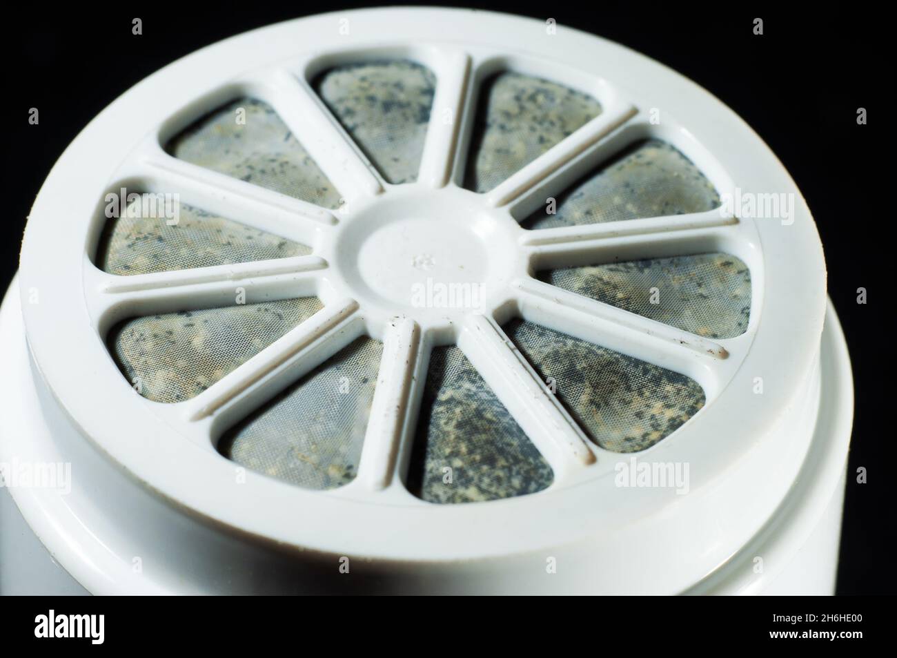 The bottom of the replaceable water filter. Hole from which water flows ...