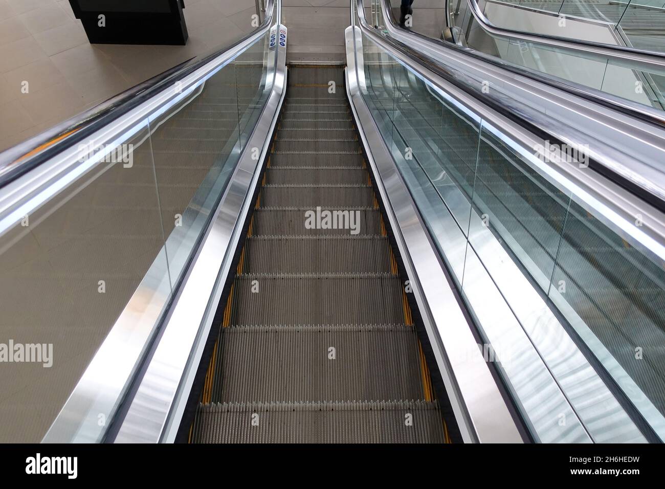 Image of an escalator without people, the sensation of movement of the ...