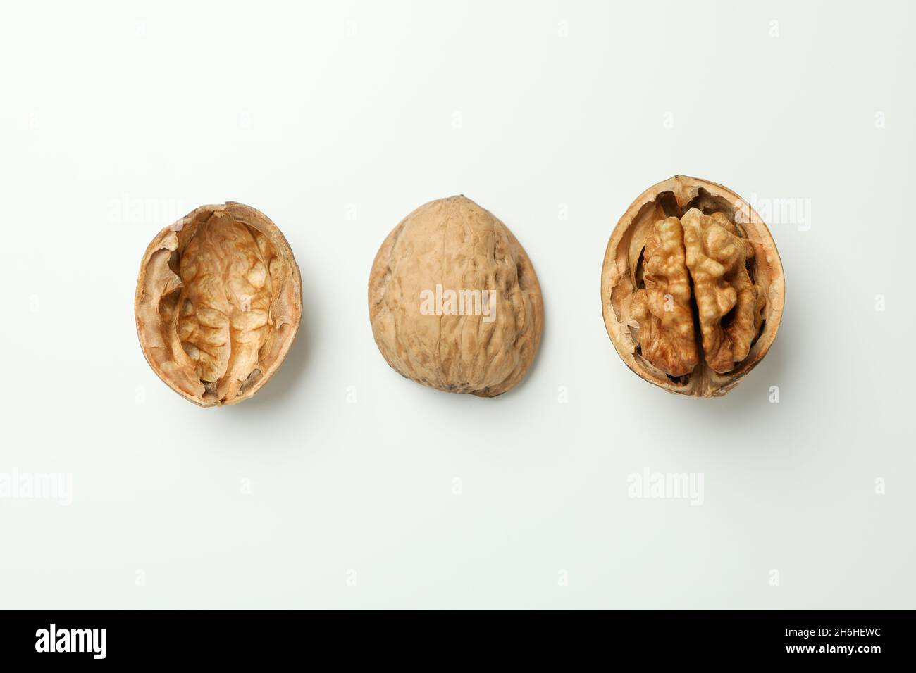 Walnuts with nutshell on white background, close up Stock Photo - Alamy