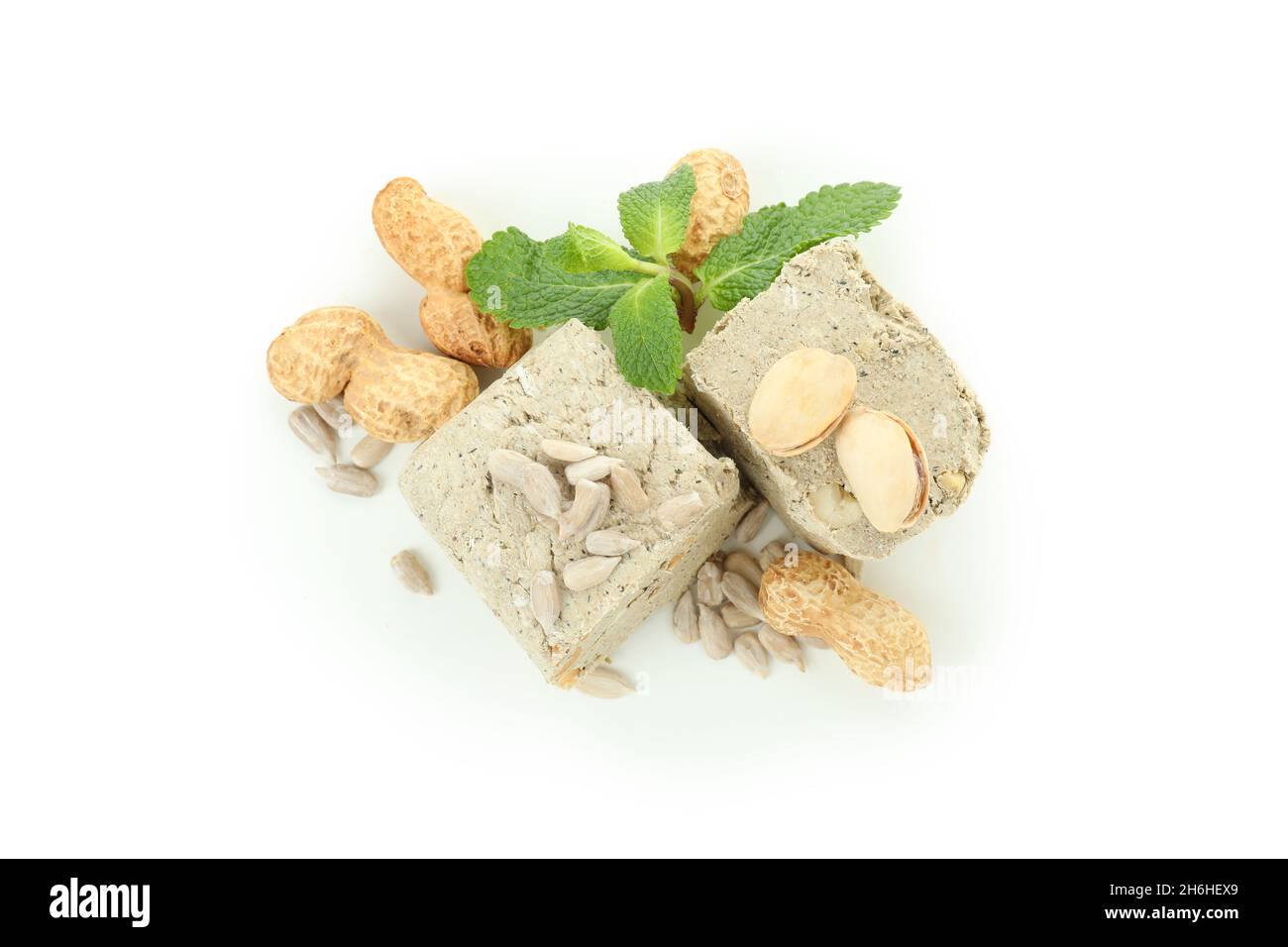 Halva with nuts isolated on white background Stock Photo - Alamy