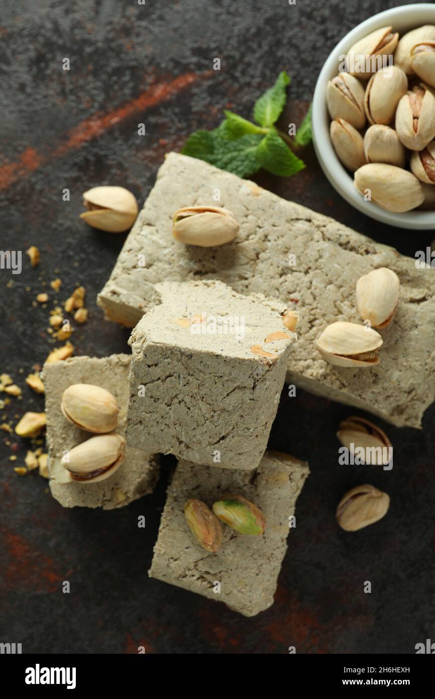 Concept of tasty food with halva on dark textured background Stock ...
