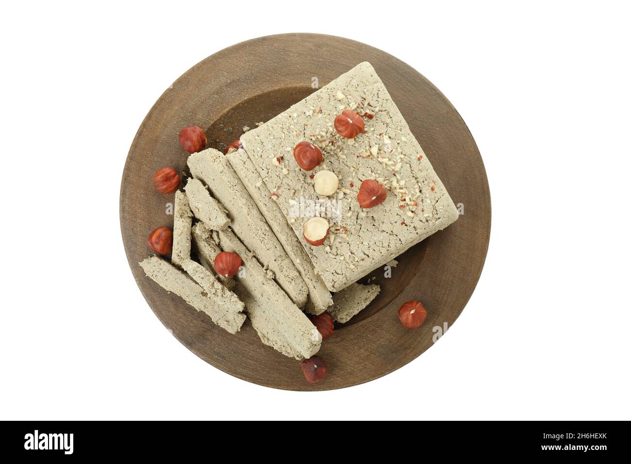 Concept of tasty food with halva isolated on white background Stock Photo - Alamy