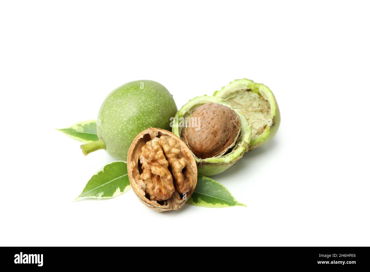 Walnuts with nut peel isolated on white background Stock Photo - Alamy
