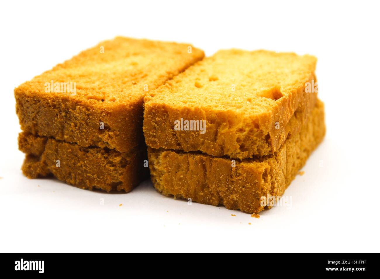 Crispy rusk on white background with selective focus Stock Photo - Alamy