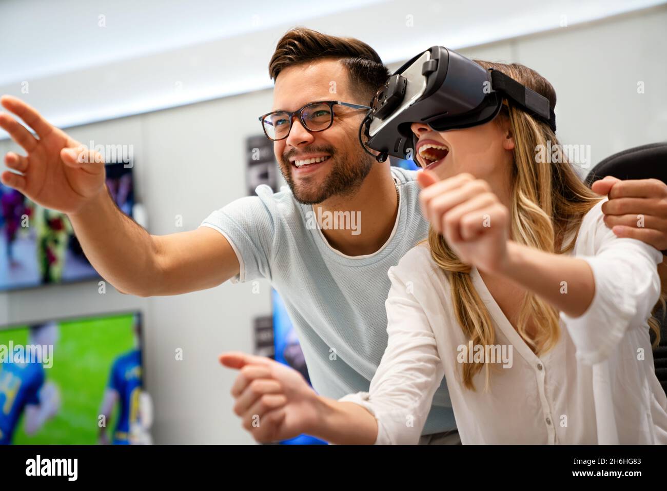 Portrait of happy people having fun with virtual reality glasses ...