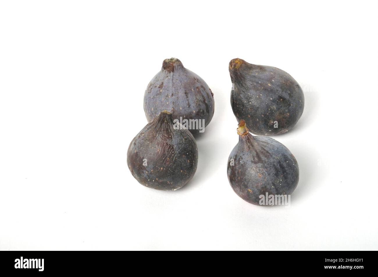 Spanish figs on a white background Stock Photo - Alamy
