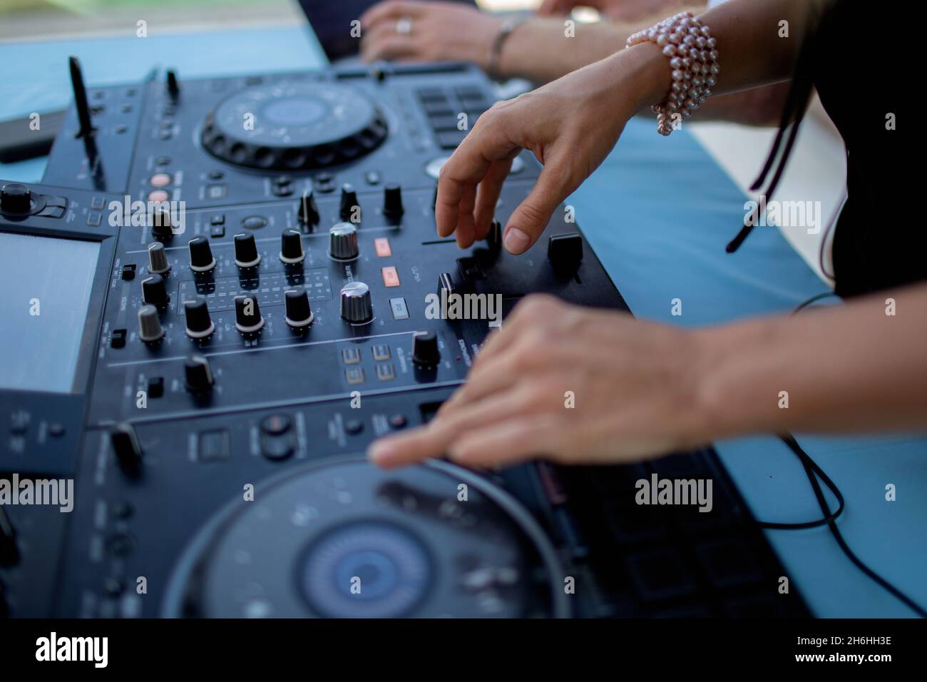 DJ hands playing at the console. High quality photo Stock Photo - Alamy