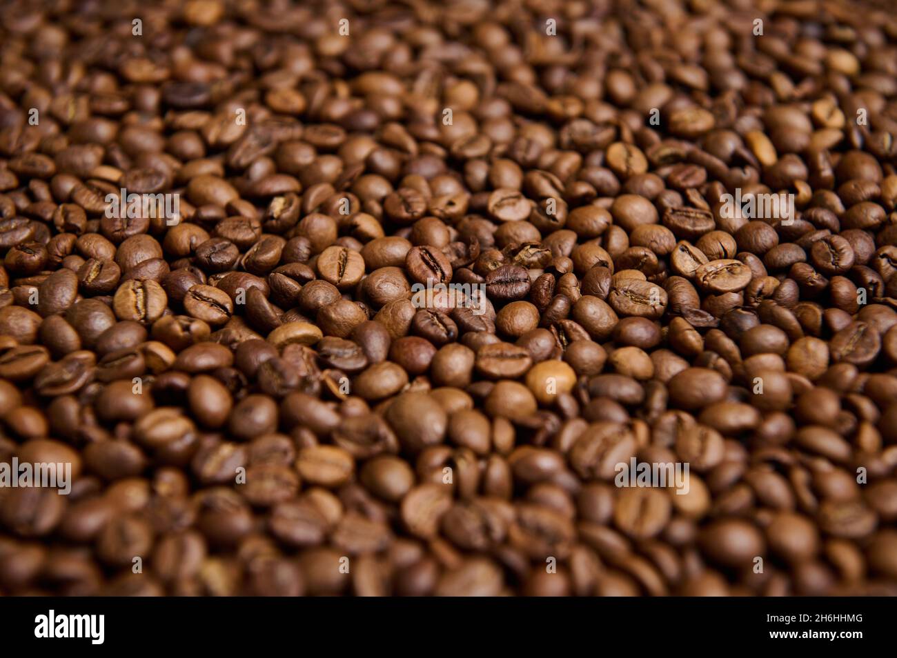 Close-up of fresh roasted coffee beans. Coffee grains background. Food ...