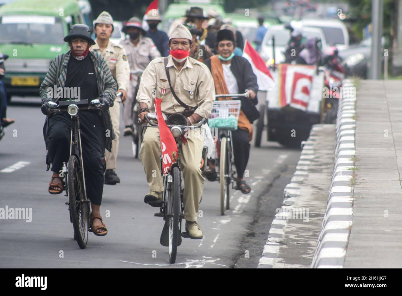 Bogor onthel bicycle community wearing Indonesian Heroes costume takes ...