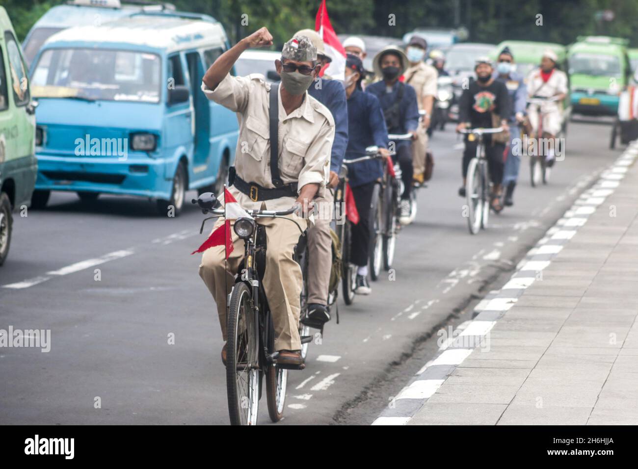 Bogor onthel bicycle community wearing Indonesian Heroes costume takes ...