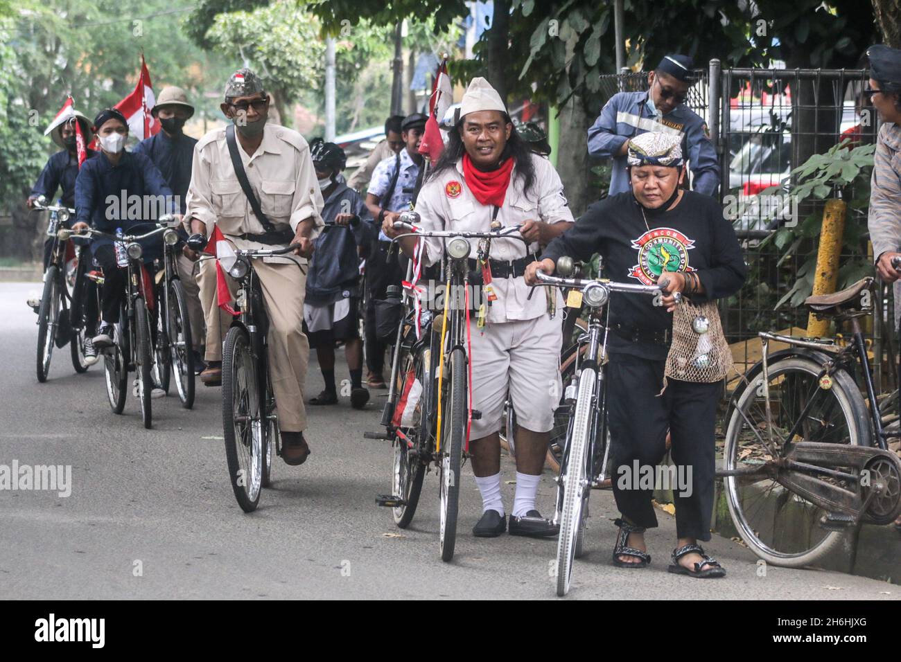Bogor onthel bicycle community wearing Indonesian Heroes costume takes ...