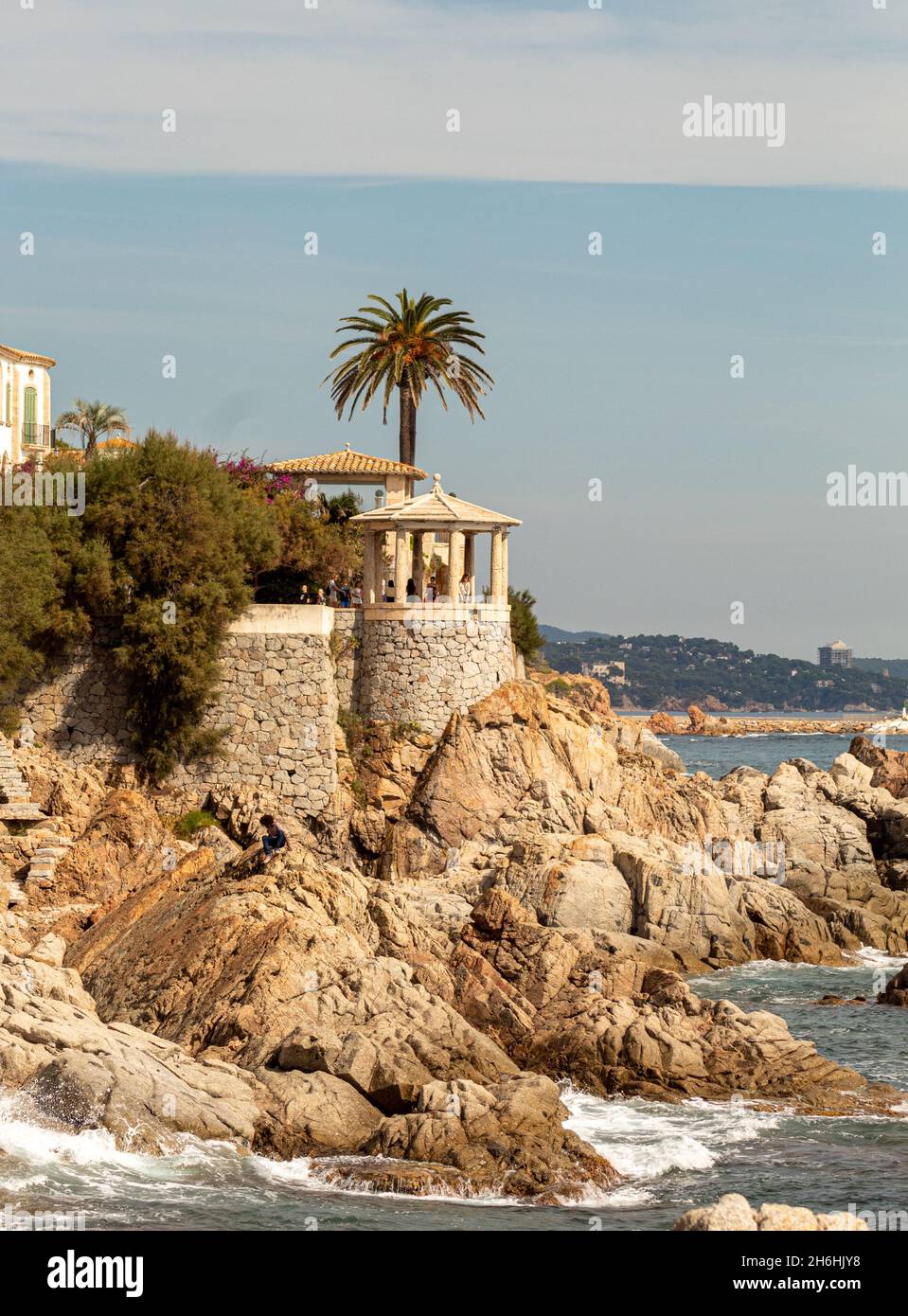 Vertical sho of Cami Ronda de S'Agaro a Sa Conca S'Agaro with rocks on ...