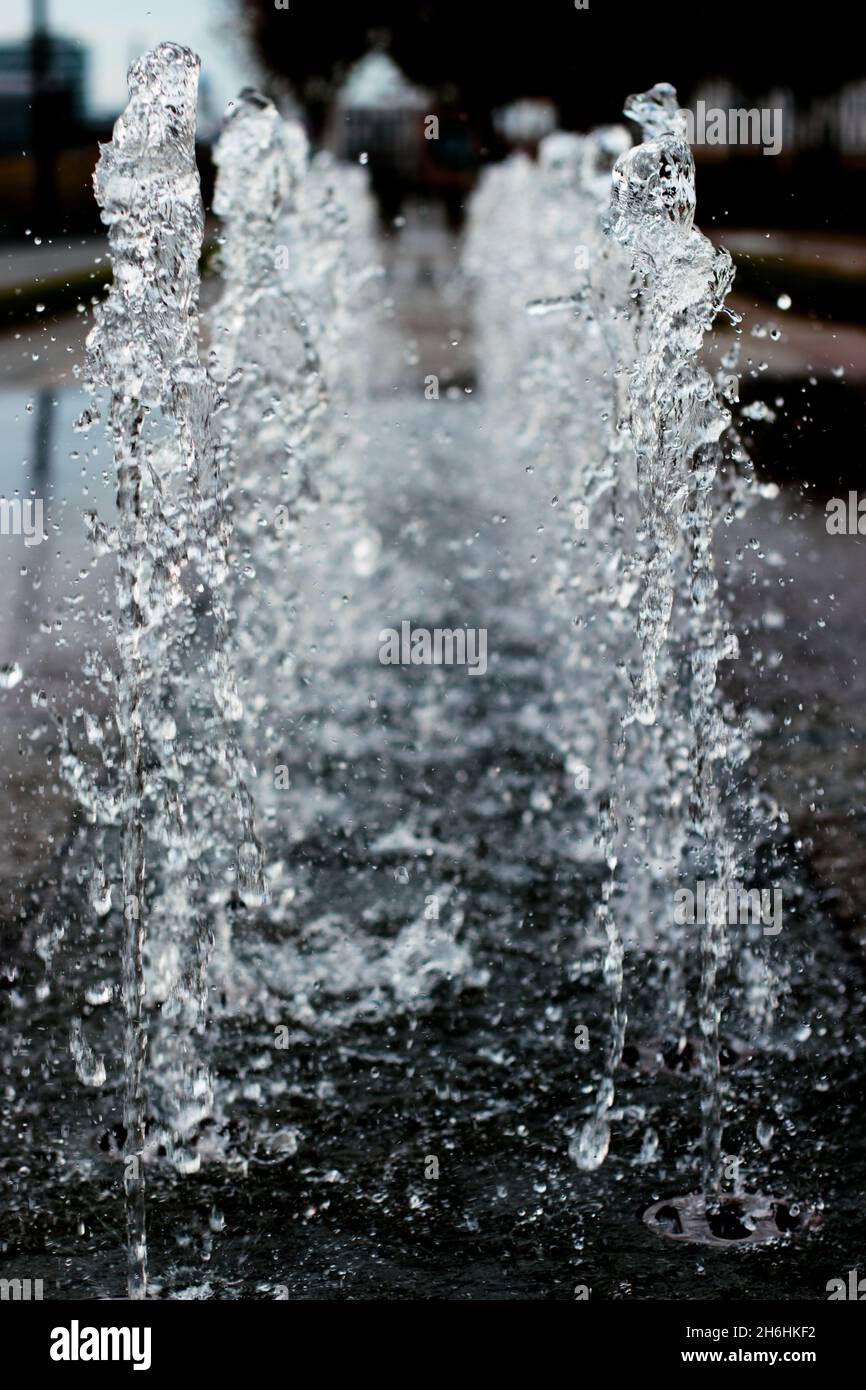 Vertical shot of water fountains in a park Stock Photo - Alamy