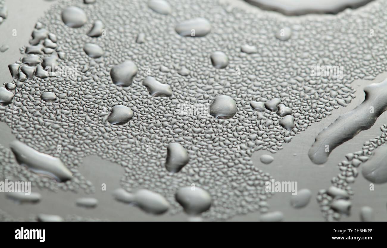 Macro background with water droplets condensation pattern on metal ...