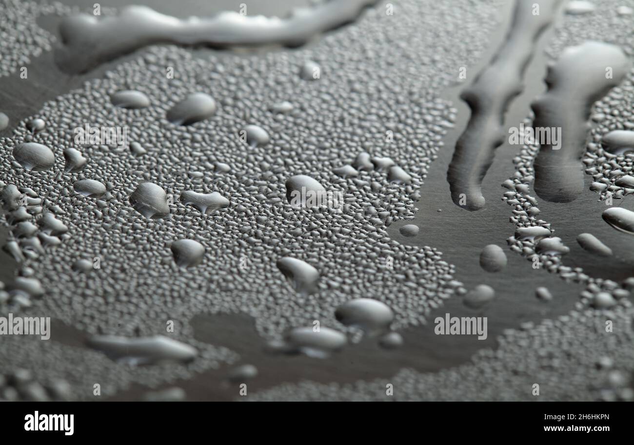 Macro background with water droplets condensation pattern on metal ...