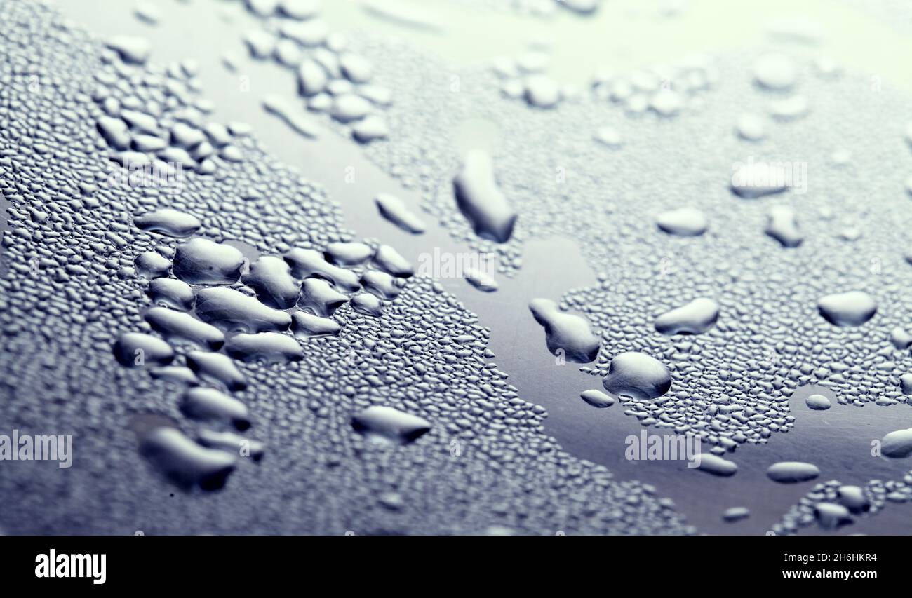 Macro background with water droplets condensation pattern on metal ...