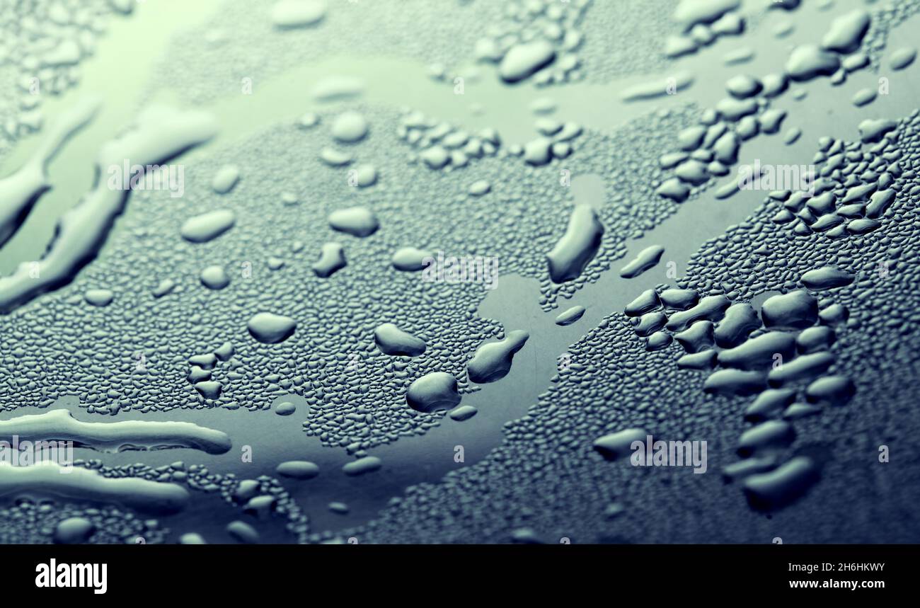 Macro background with water droplets condensation pattern on metal ...