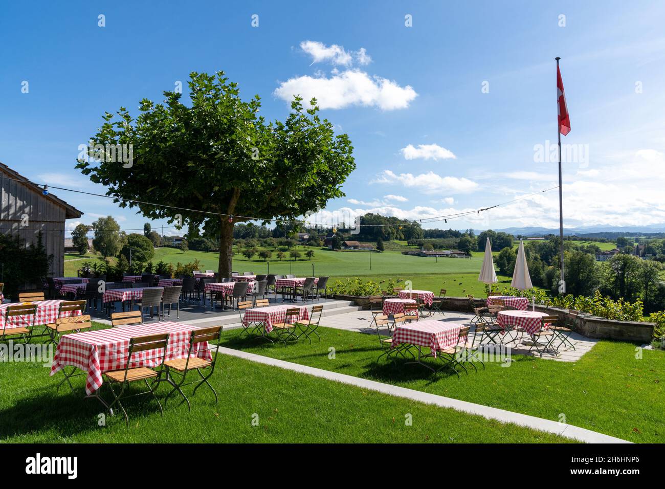 idyllic outdoor restaurant with a great view and colorful table ...
