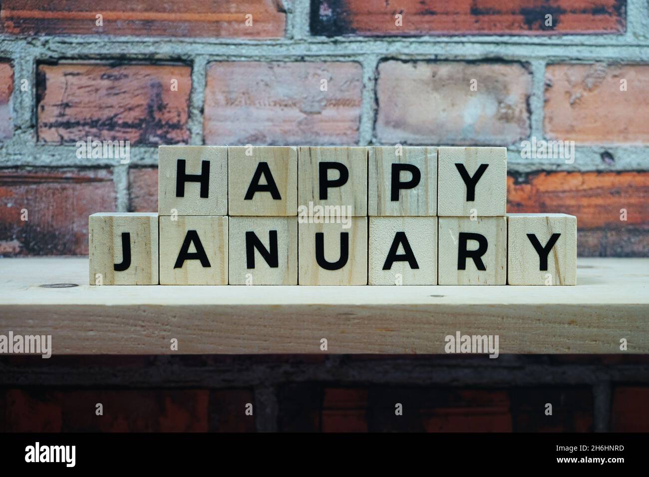 Happy January alphabet letter on shelves wooden background Stock Photo ...