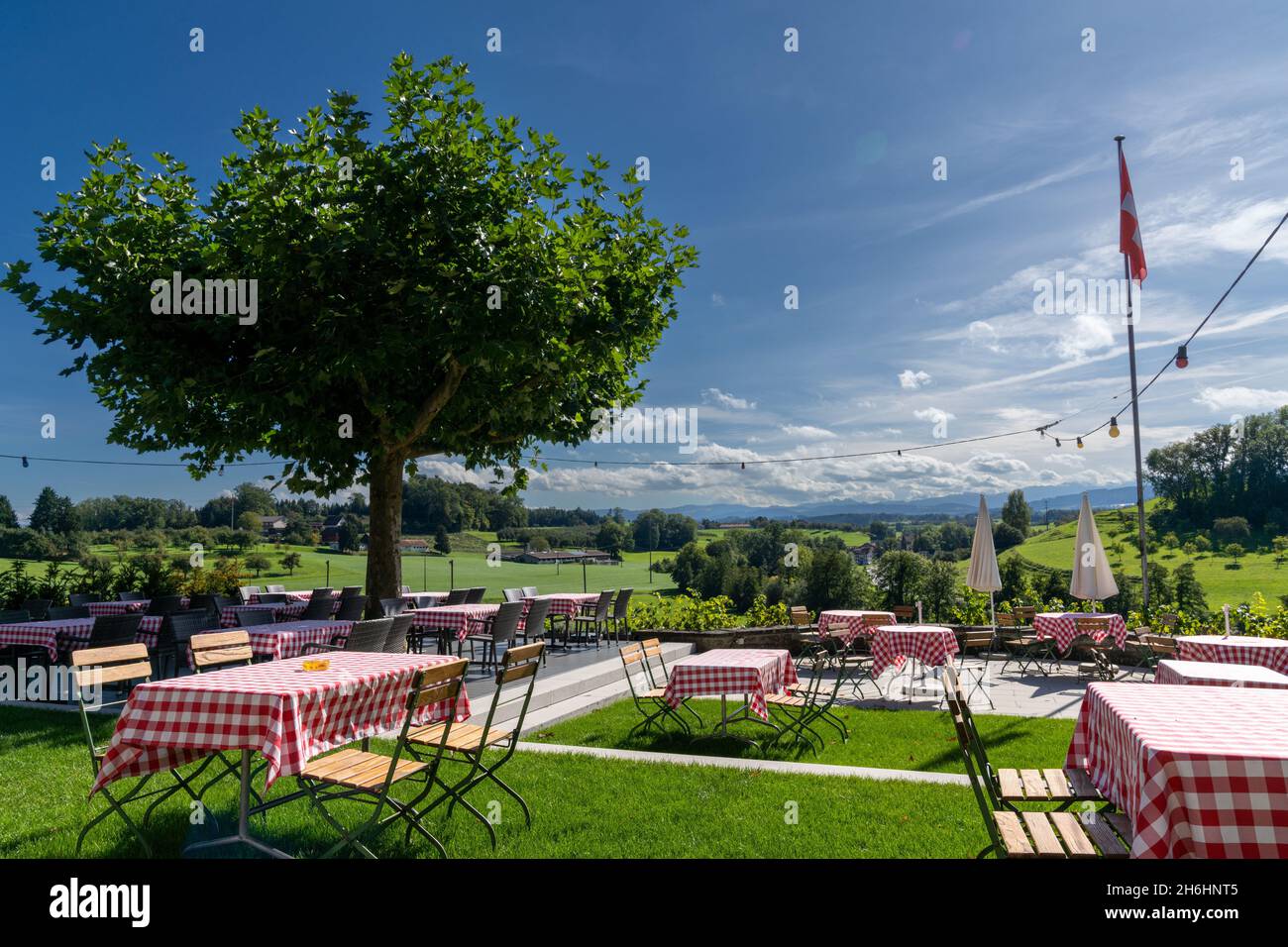 idyllic outdoor restaurant with a great view and colorful table ...