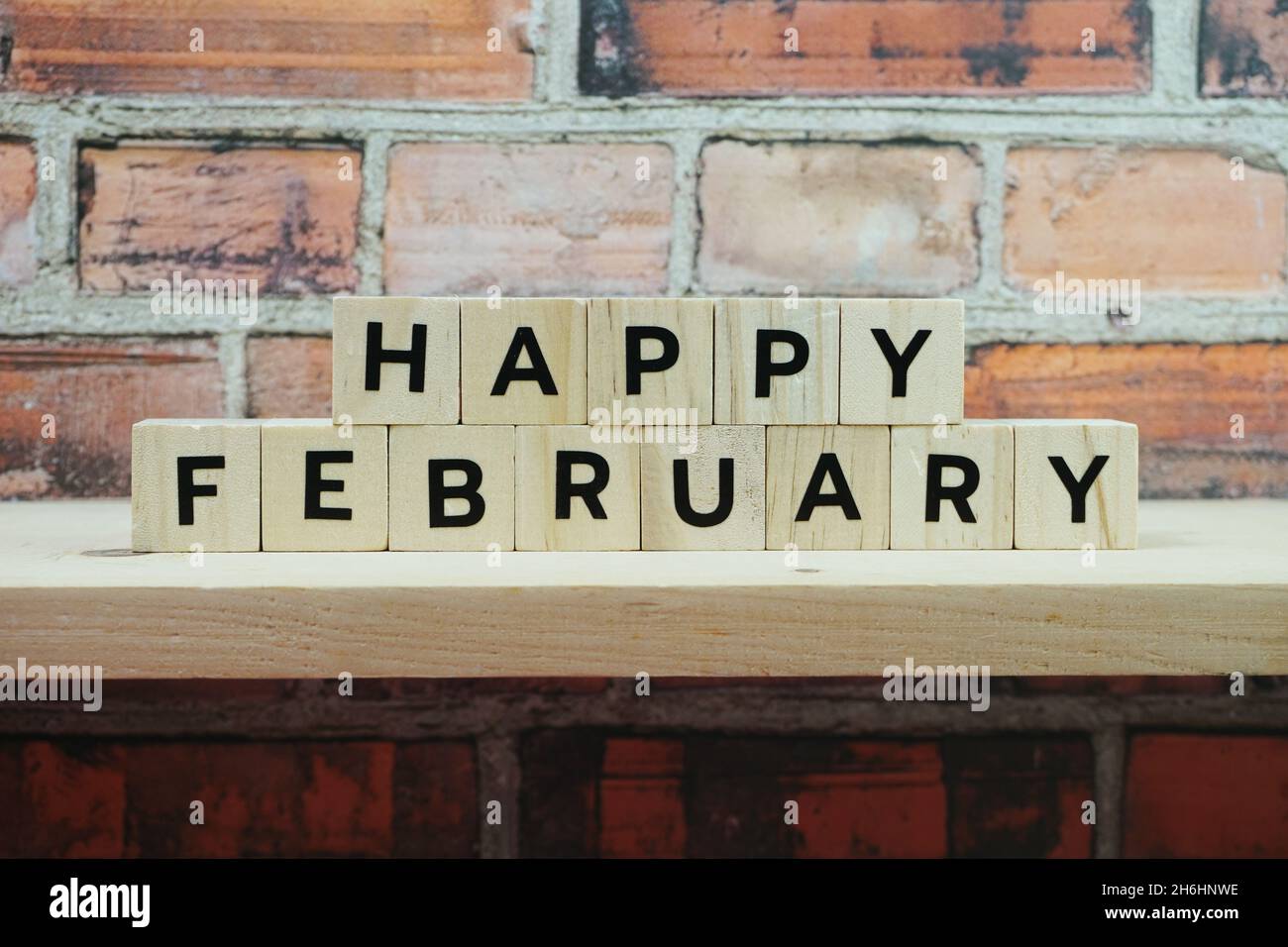 Happy February alphabet letter on shelves wooden background Stock Photo ...