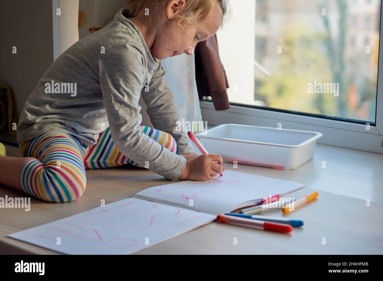 3 years girl creative arts. Child raws a picture. Kindergarden and ...