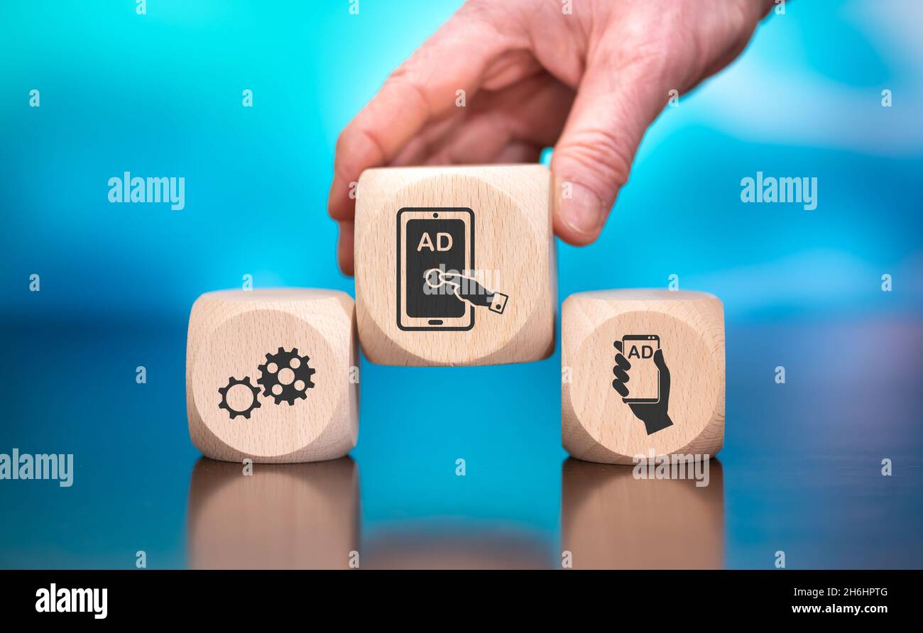 Wooden blocks with symbol of advertising concept on blue background ...