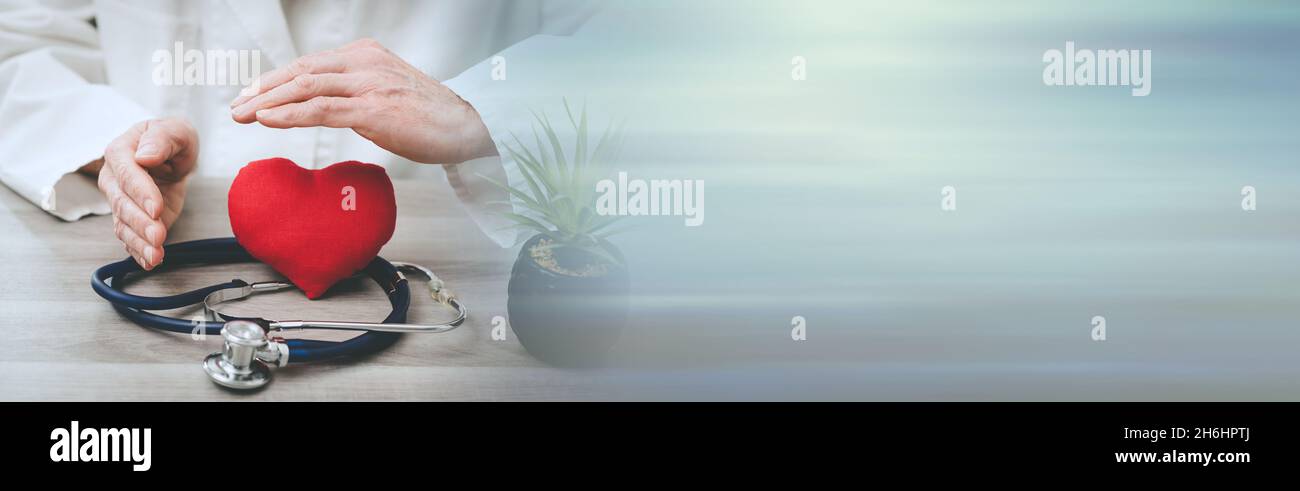 Hands of doctor protecting a red heart; panoramic banner Stock Photo ...