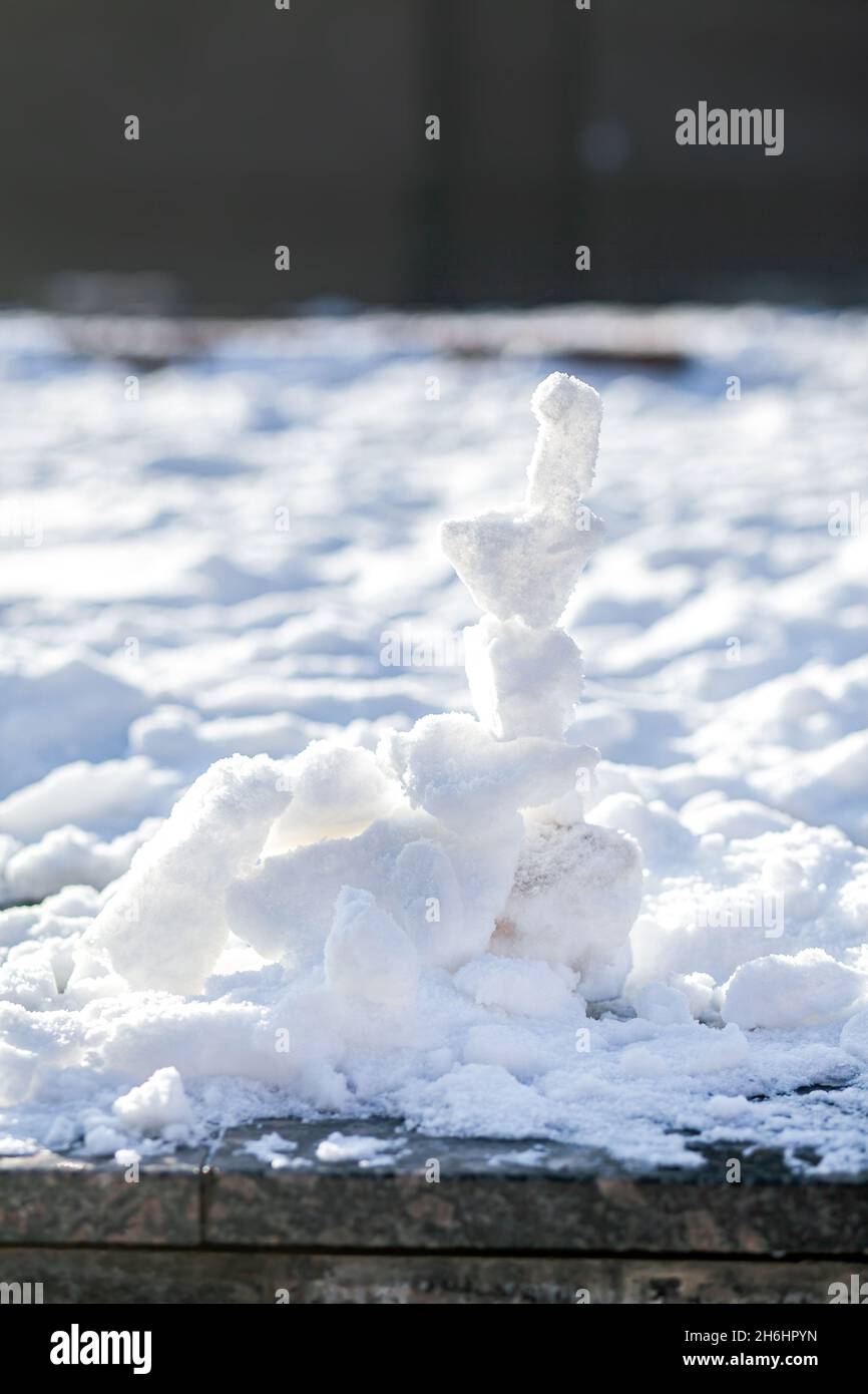 Pyramid of snowballs on a snowy background on a sunny winter day Stock ...