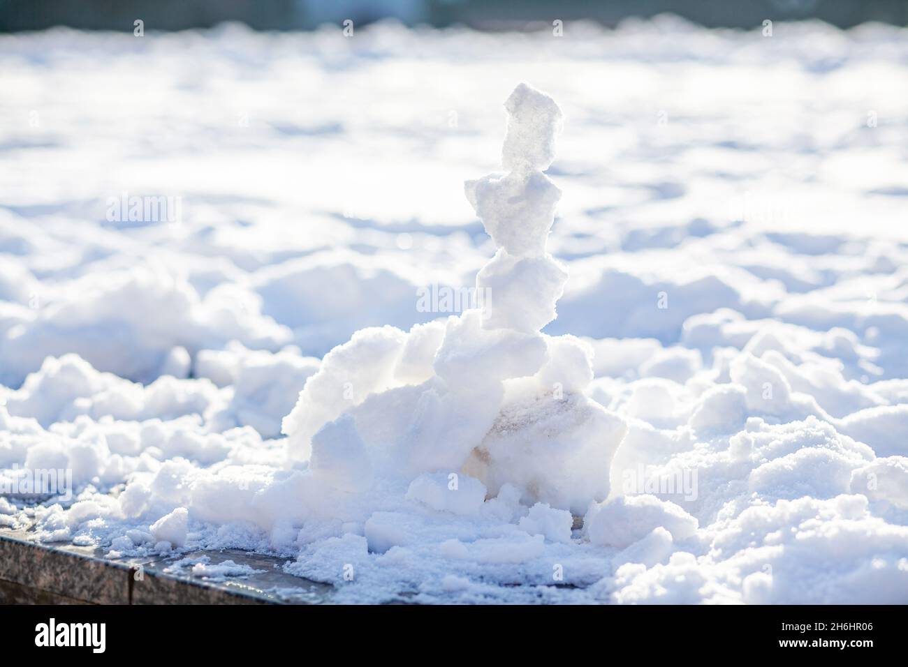Pyramid of snowballs on a snowy background on a sunny winter day Stock ...