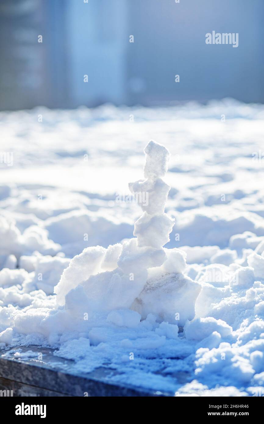 Pyramid of snowballs on a snowy background on a sunny winter day Stock ...
