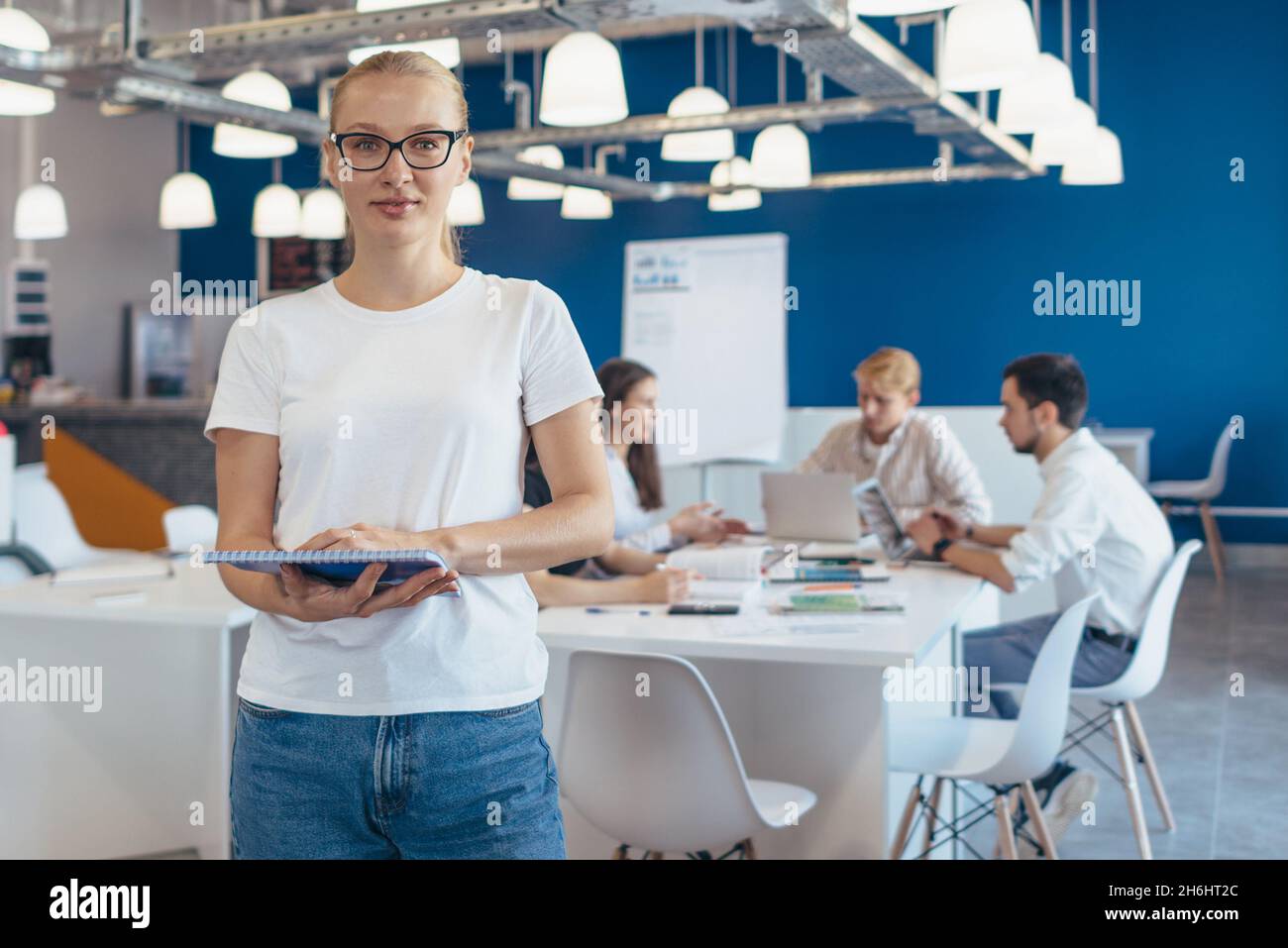 Young woman professional portrait in the office Stock Photo - Alamy