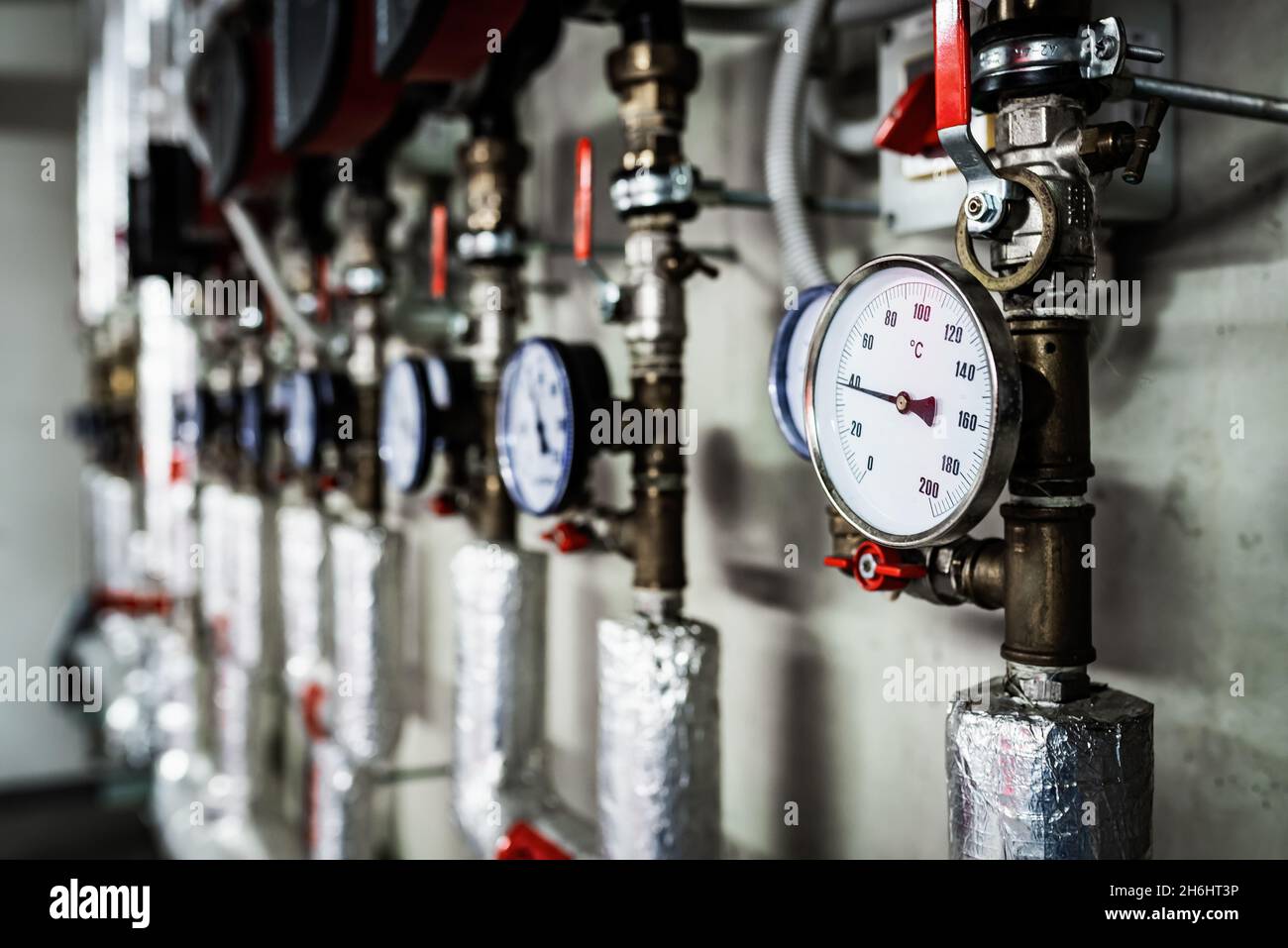 Barometers on pressure pipes, technical room with heat and water ...