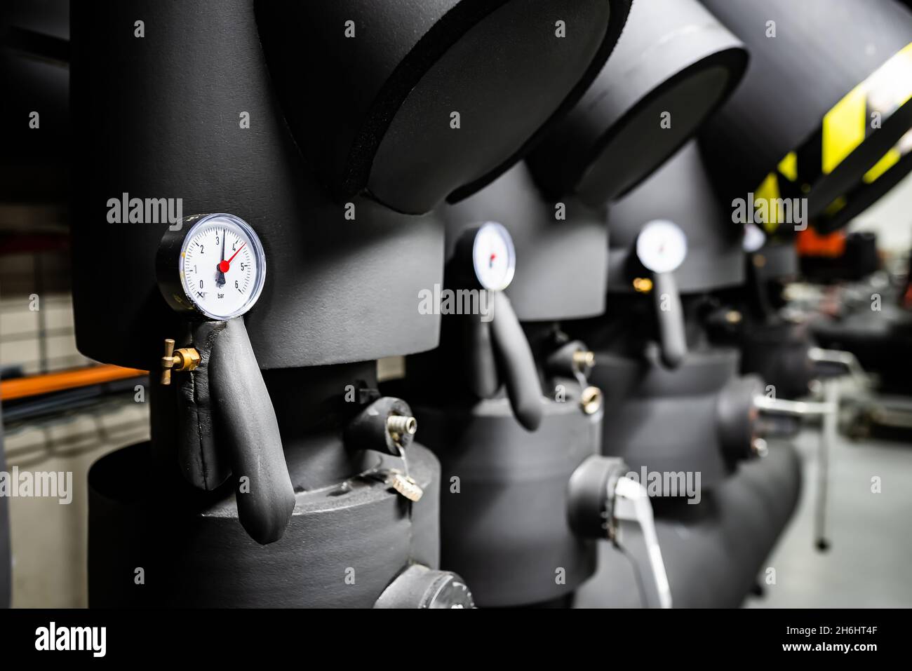 Barometers on pressure pipes, technical room with heat and water ...