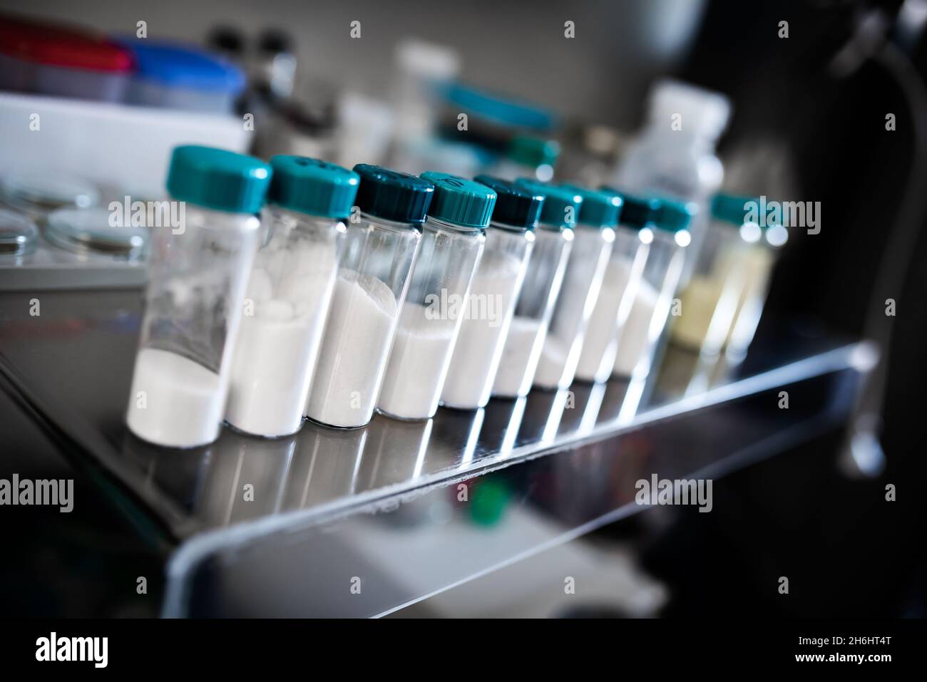 Glass closable test tubes filled with solid powder chemical Stock Photo ...