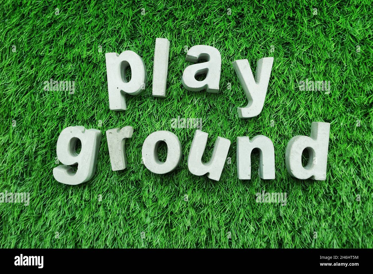 playground word alphabet letter top view on green grass Stock Photo - Alamy