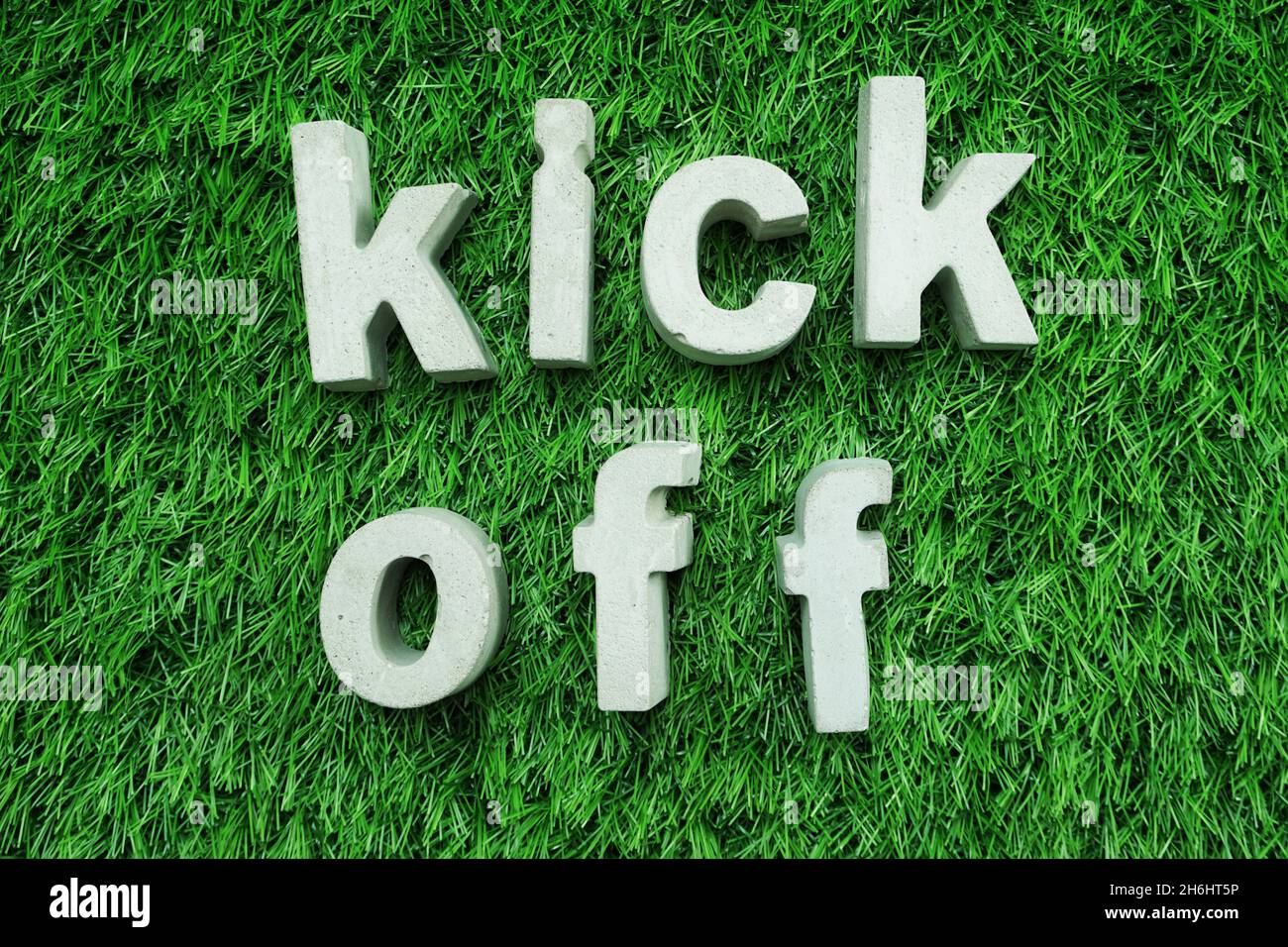 Kick Off alphabet letter top view on green grass Stock Photo - Alamy