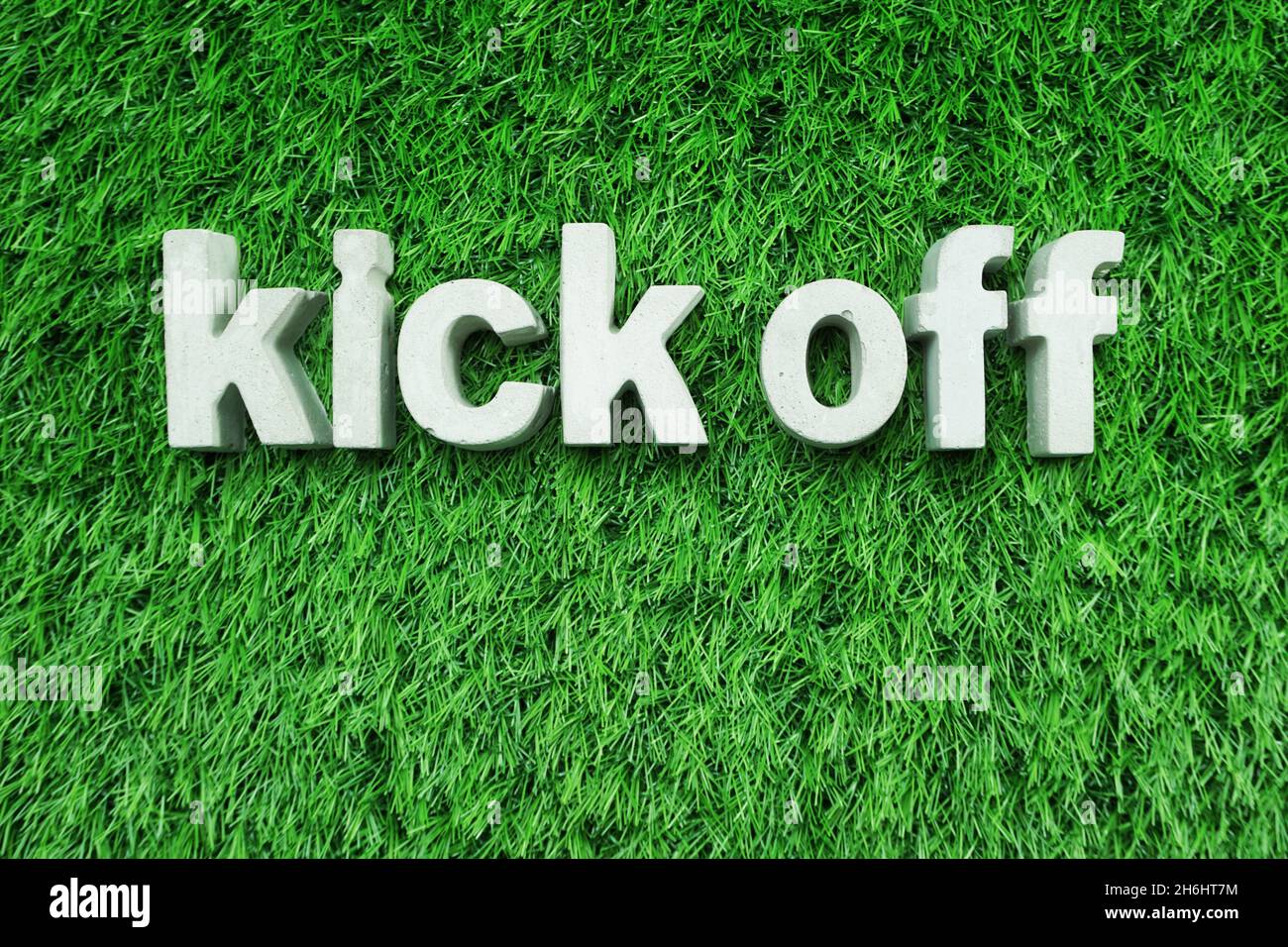 Kick Off alphabet letter top view on green grass Stock Photo - Alamy