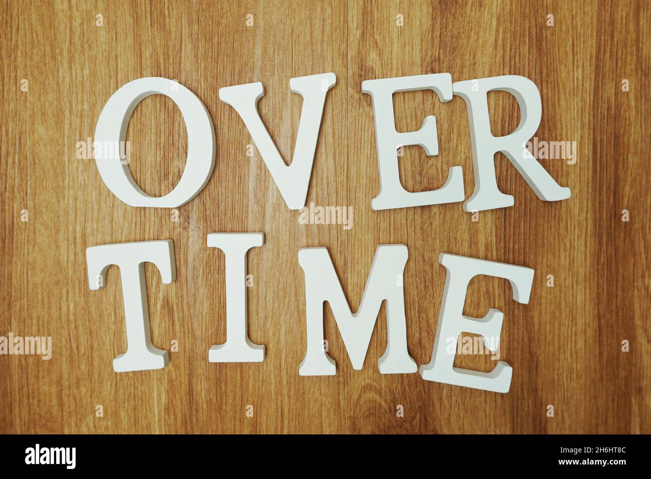 Over Time Word alphabet letters on wooden background Stock Photo - Alamy
