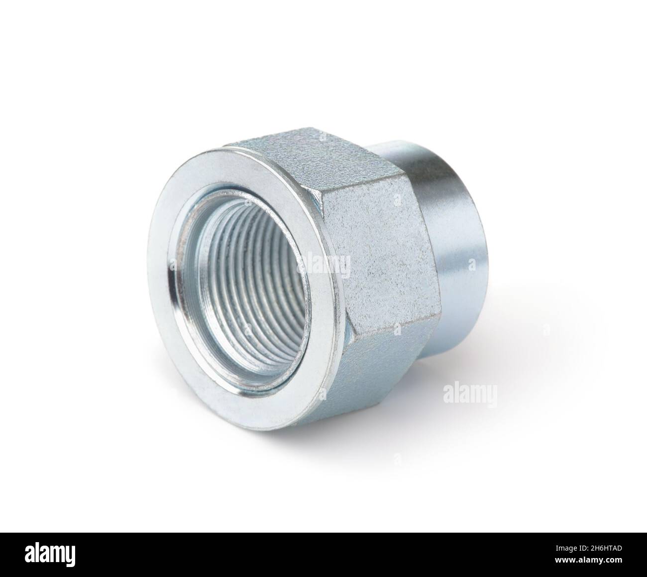 Steel straight sleeve nut isolated on white Stock Photo - Alamy