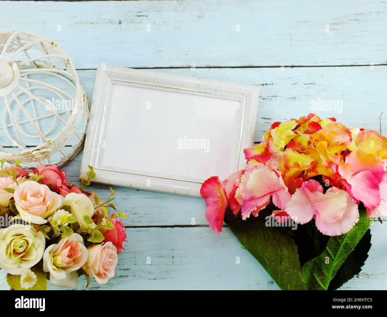 flowers bouquet and blank photo frame with copy space background Stock ...
