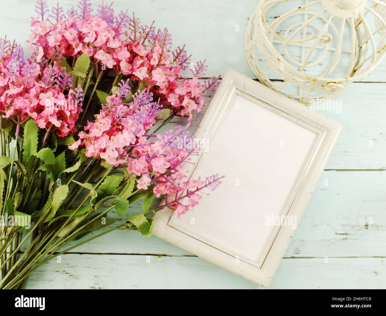 flowers bouquet and blank photo frame with copy space background Stock ...