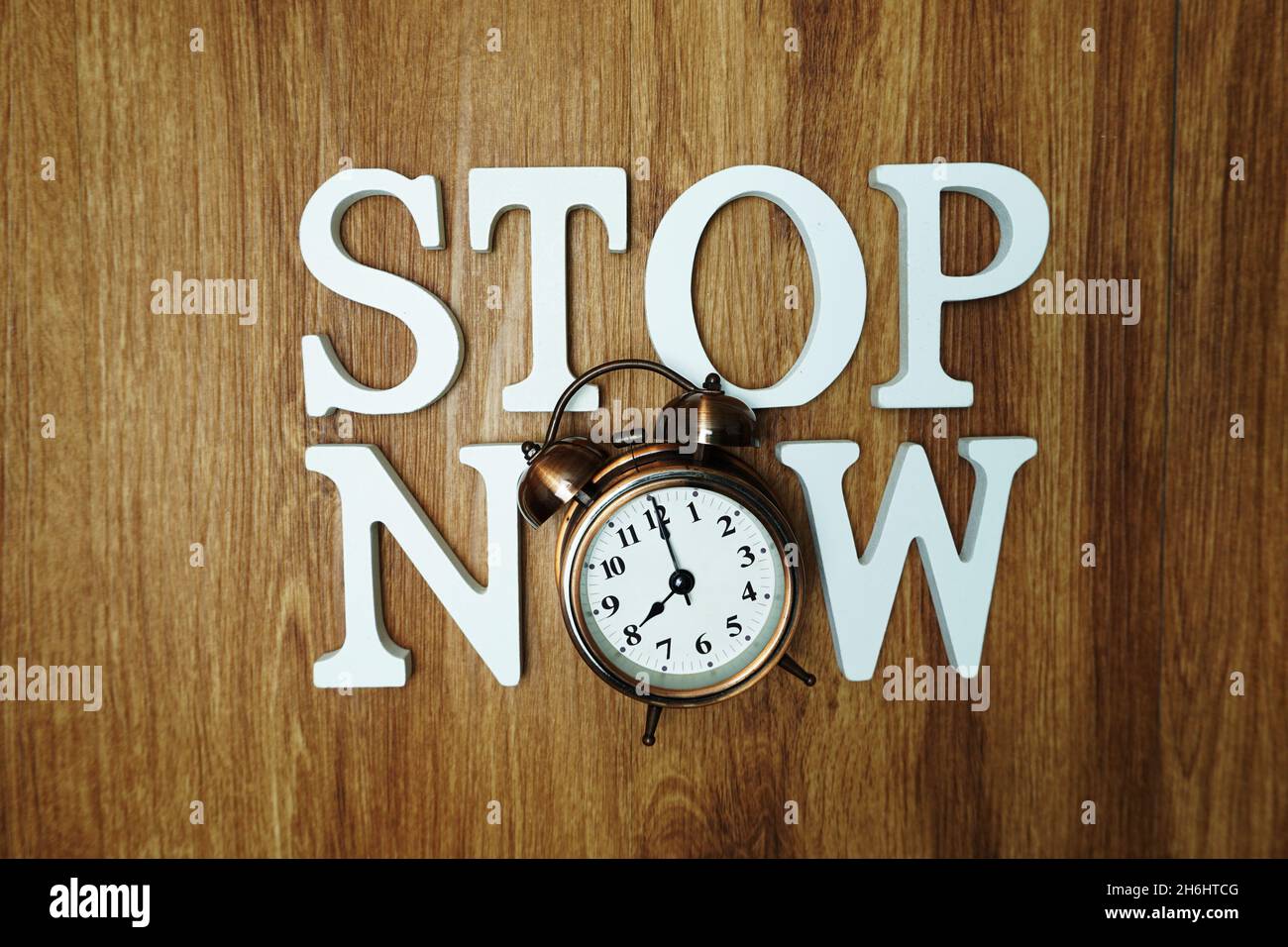 Stop Now Word alphabet letters on wooden background Stock Photo - Alamy