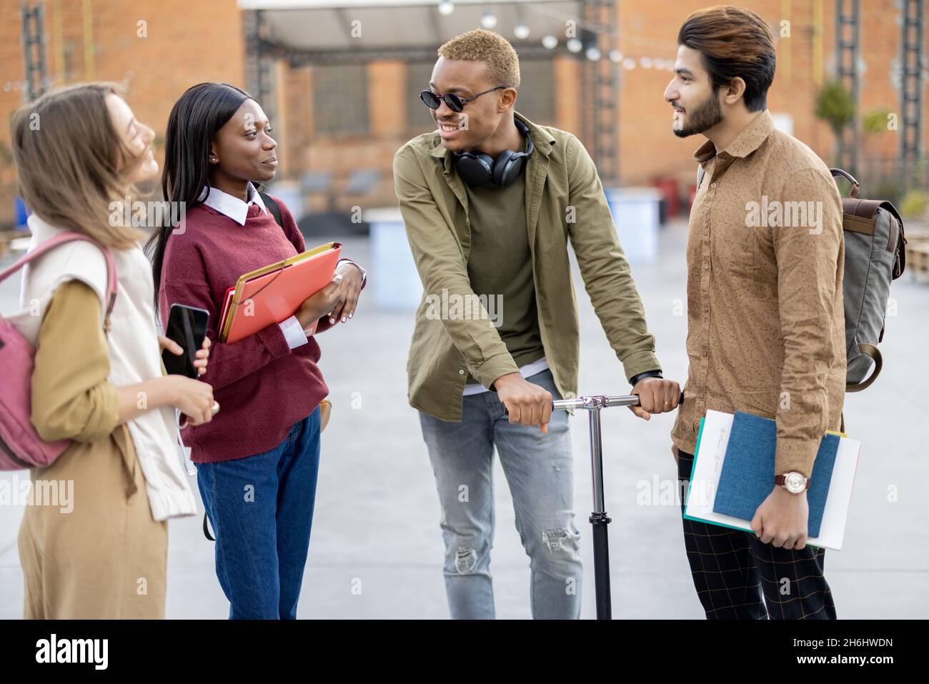 Students walk together at university campus Stock Photo - Alamy